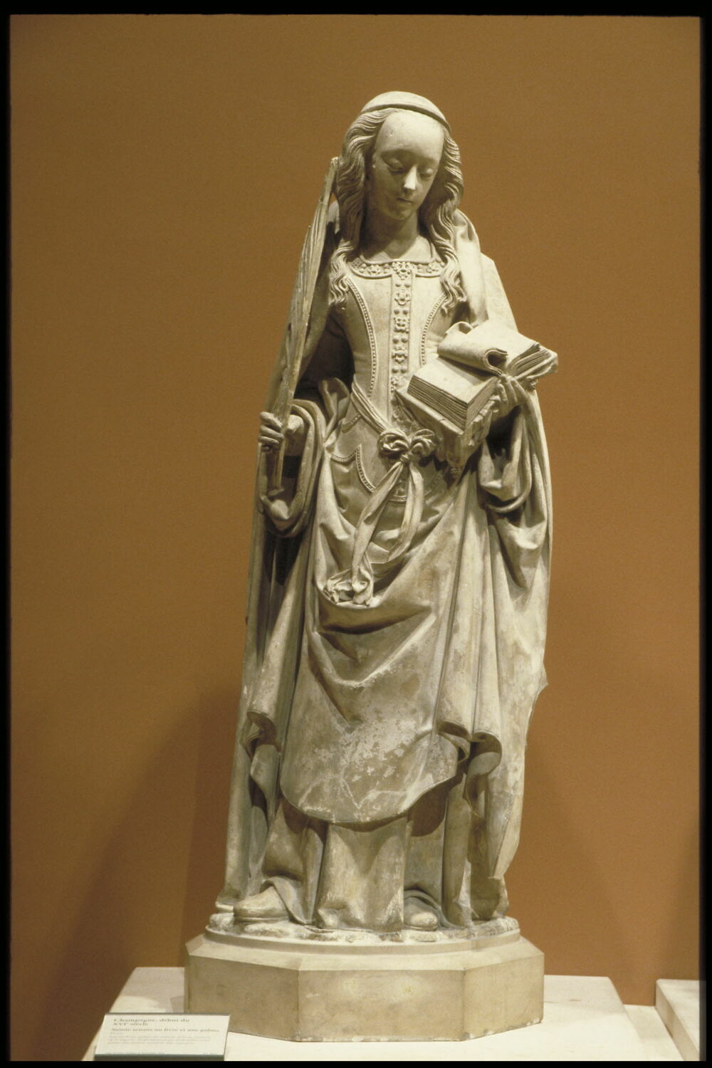 Sainte martyre tenant une palme et un livre ouvert - Louvre Collections