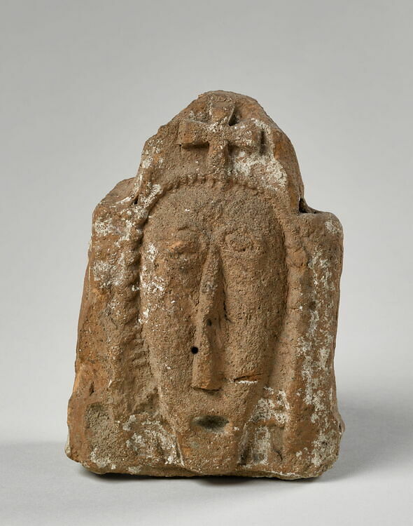 Antéfixe décorée d'un masque humain crucifère - Louvre site des collections